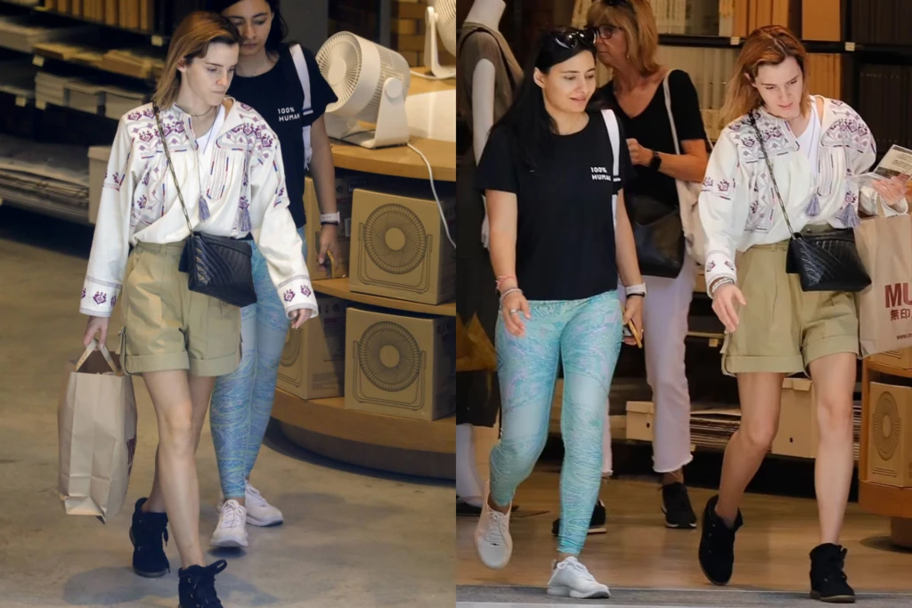 Emma Watson puts on a leggy display in khaki shorts and patterned shirt ...