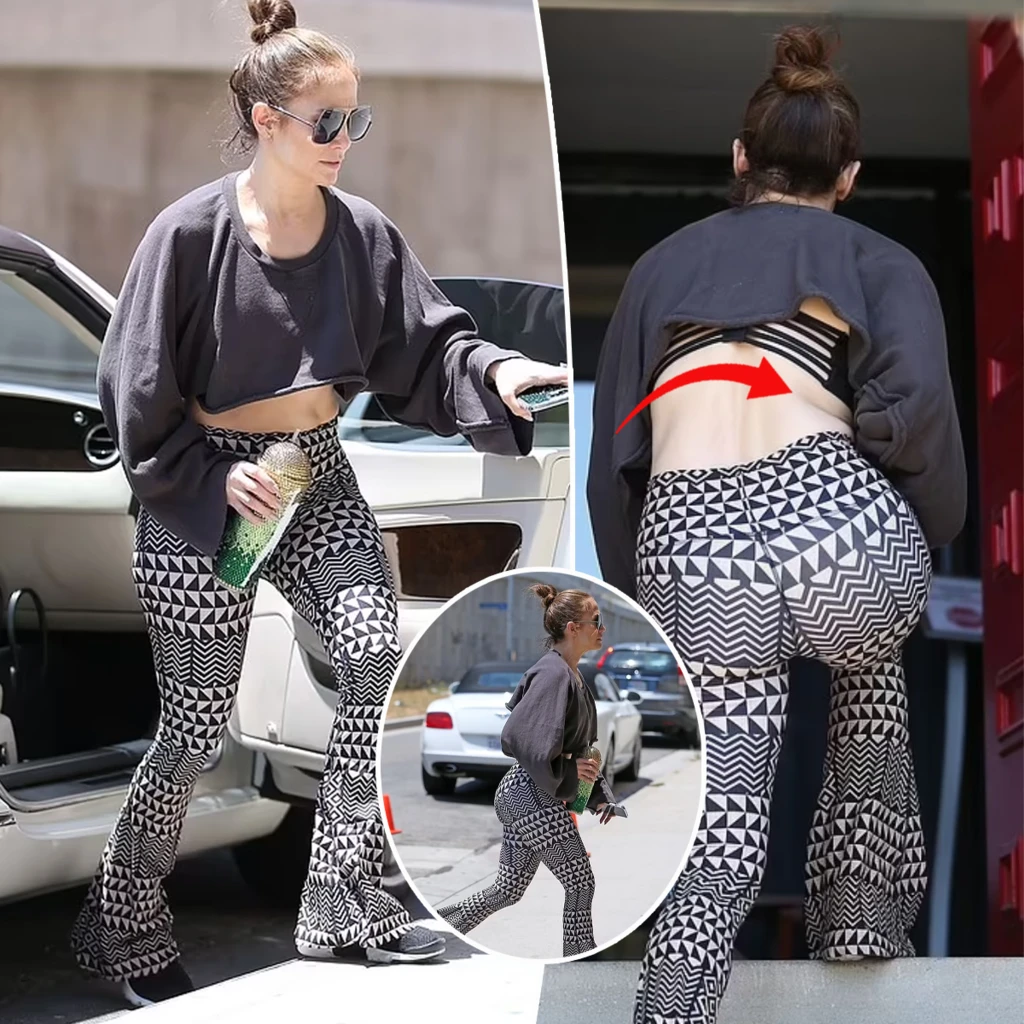 Jennifer Lopez shows off her midriff in a crop top and patterned pants ...